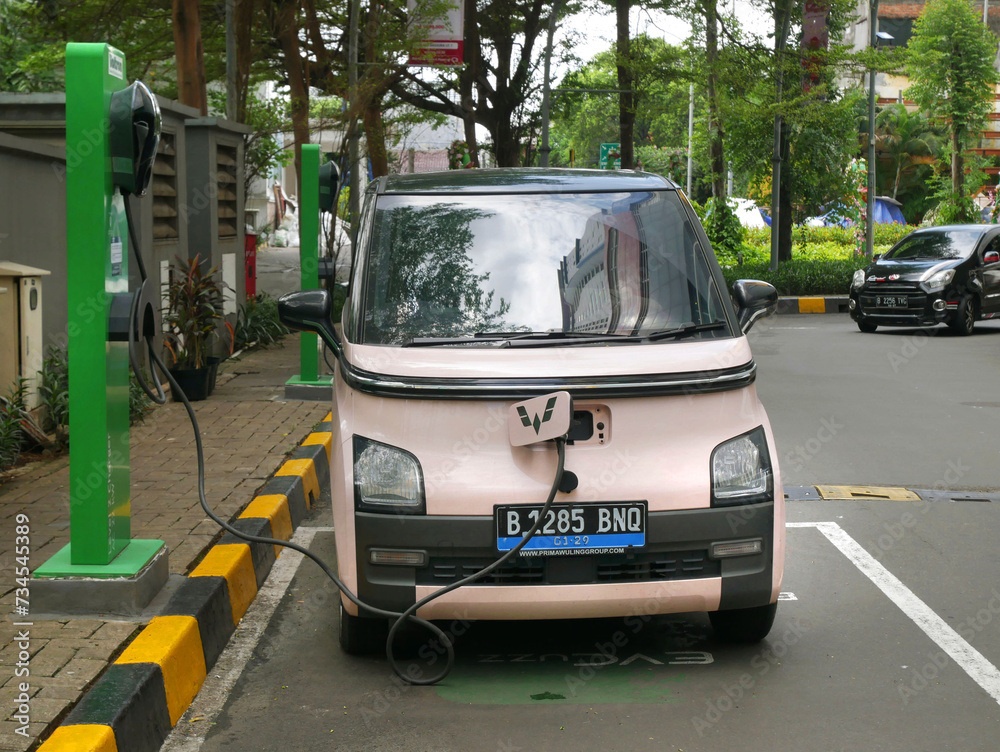 Wuling electric car is charging at charging station in jakarta ...