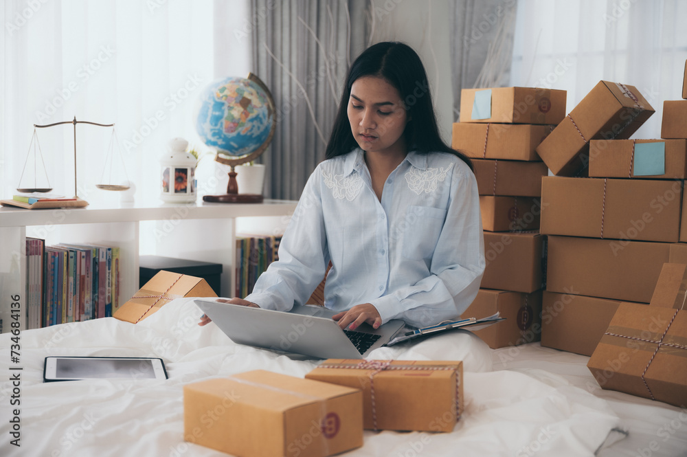 Successful and achievement female entrepreneur or owner of online small business is working with ...