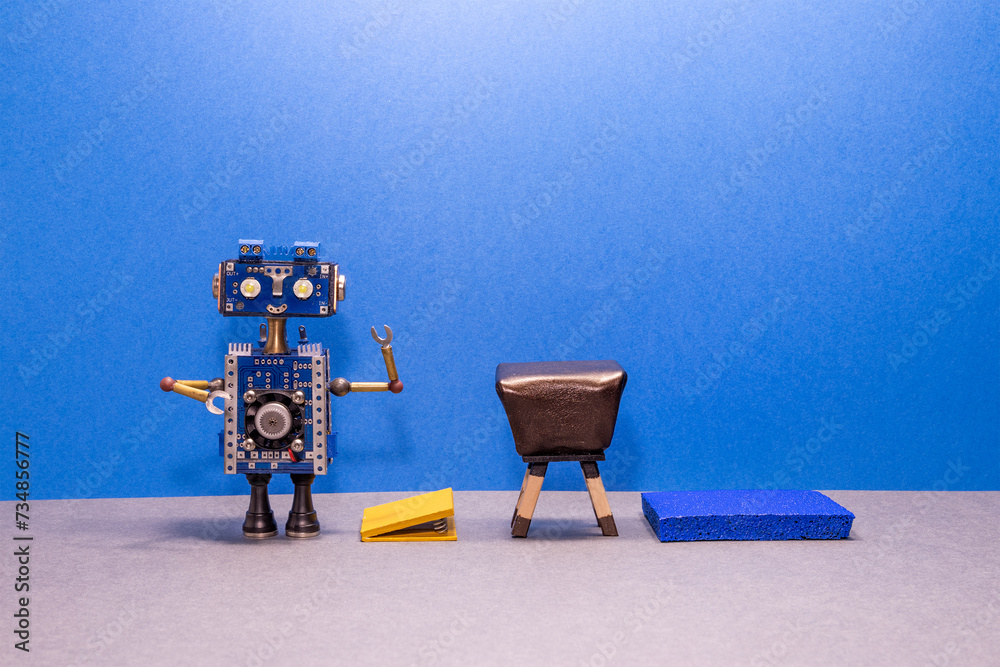 Vaulting buck. Robot athlete and jumping exercise. A toy gymnast, a ...