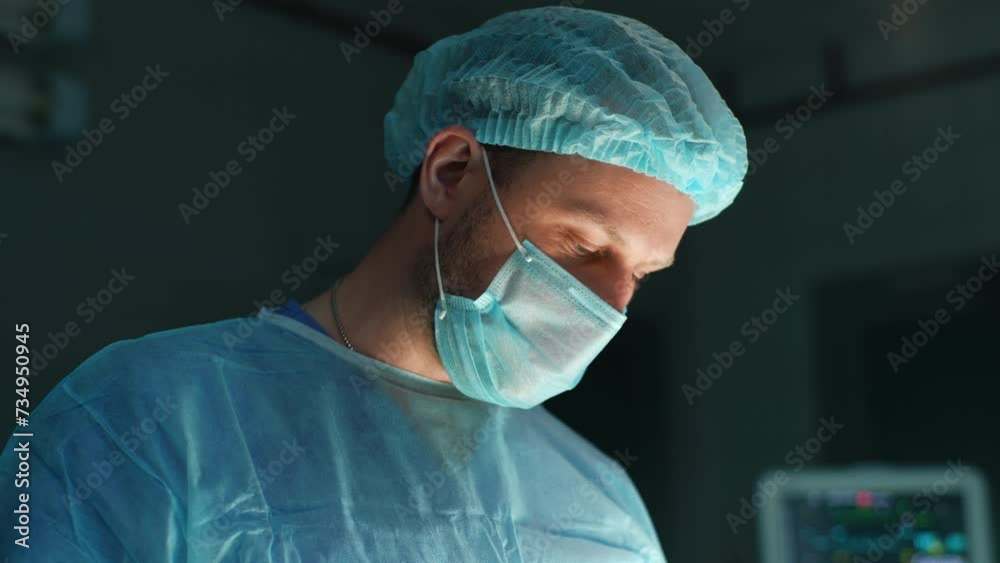 Close-up face of concentrated professional surgical doctor operating ...