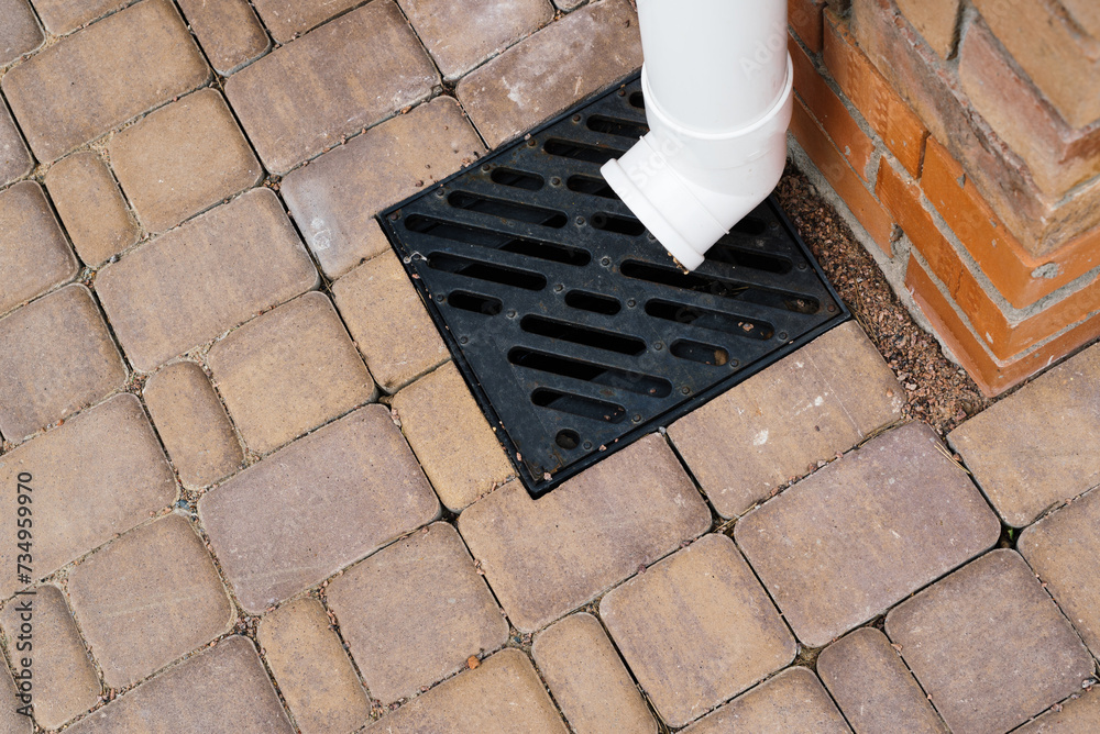 Stormwater cast iron drainage system in a pavement. Is used for ...