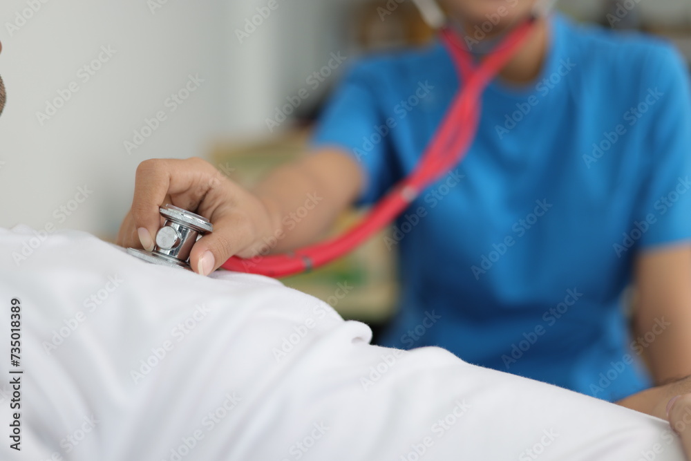 Doctor visiting a male patient on a hospital bed, Examine the patient ...