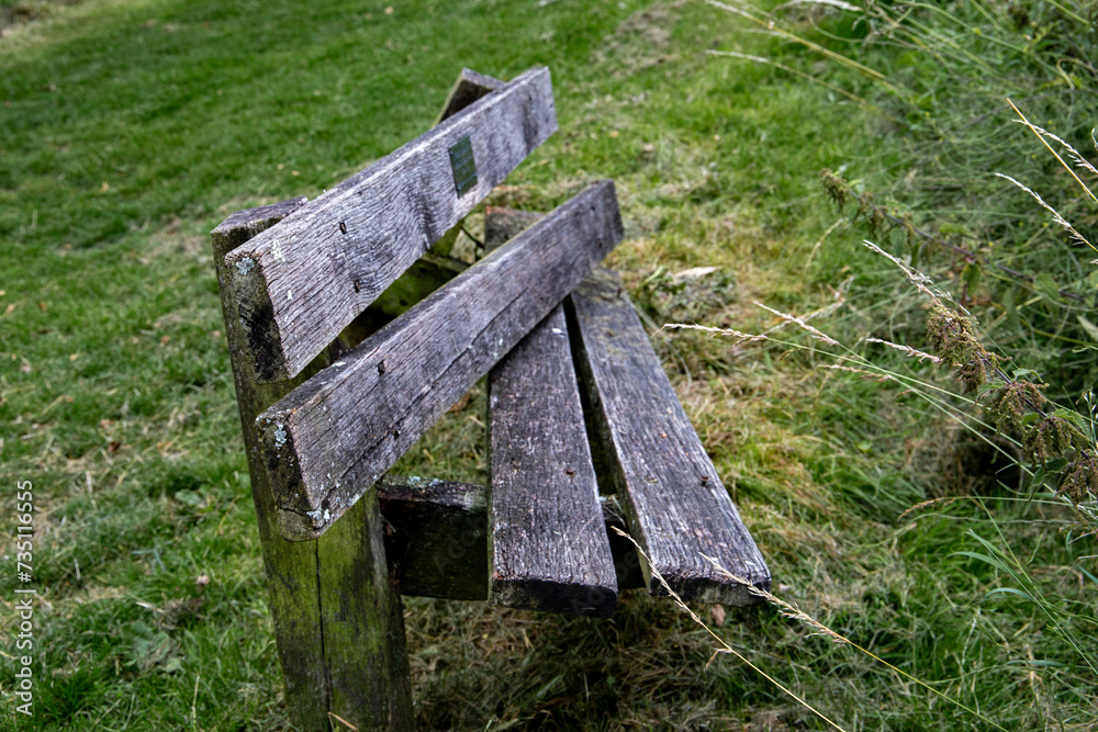 Broken collapsed wooden bench seat along the Kennet and Avon canal ...