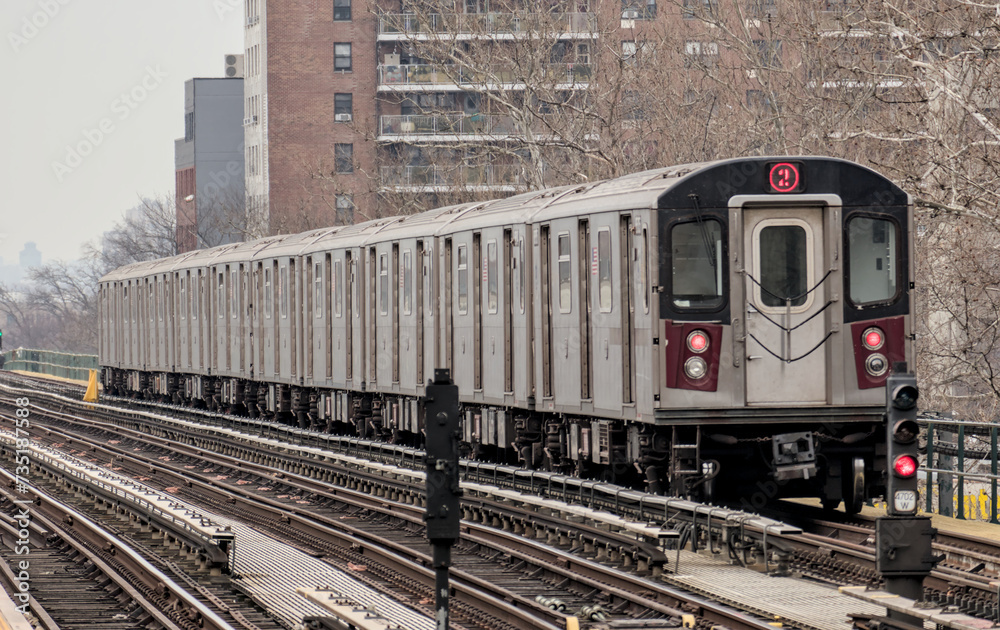 subway train on elevated track in the bronx with high rise apartment ...