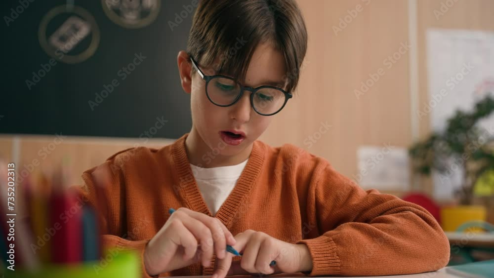 Caucasian guy boy think find idea ponder difficult task writing notes ...