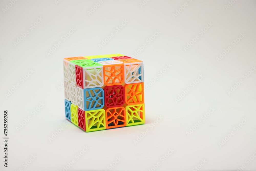 Rubik cube on isolated white background. Traditional rubik cube and modern openwork texture ...