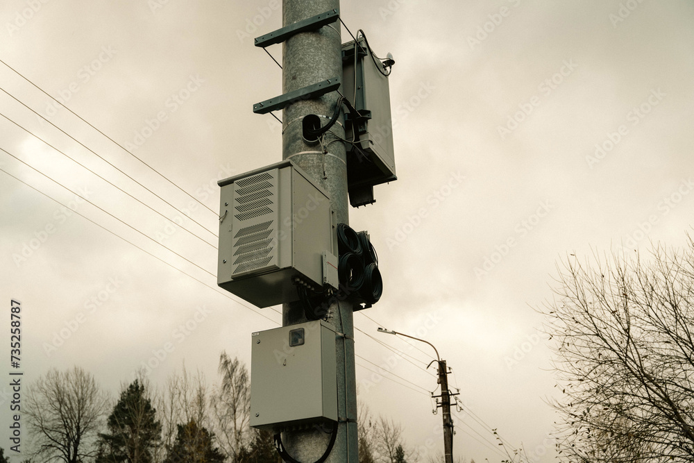 high-voltage transformer or a cell tower distribution box located high ...