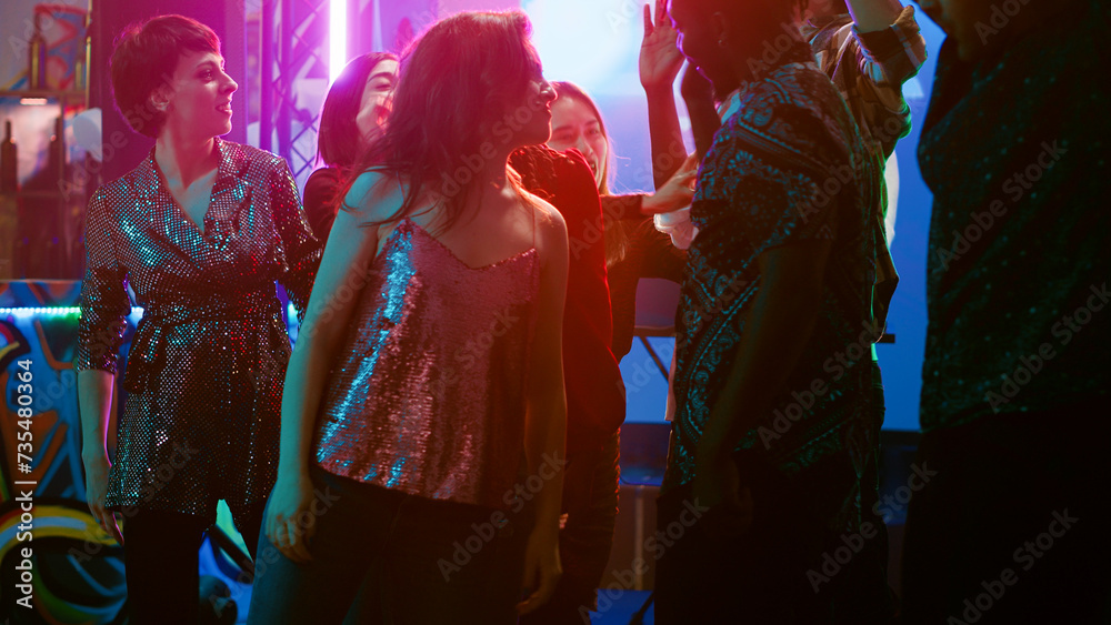 Group of people dancing at disco party, having fun together with ...