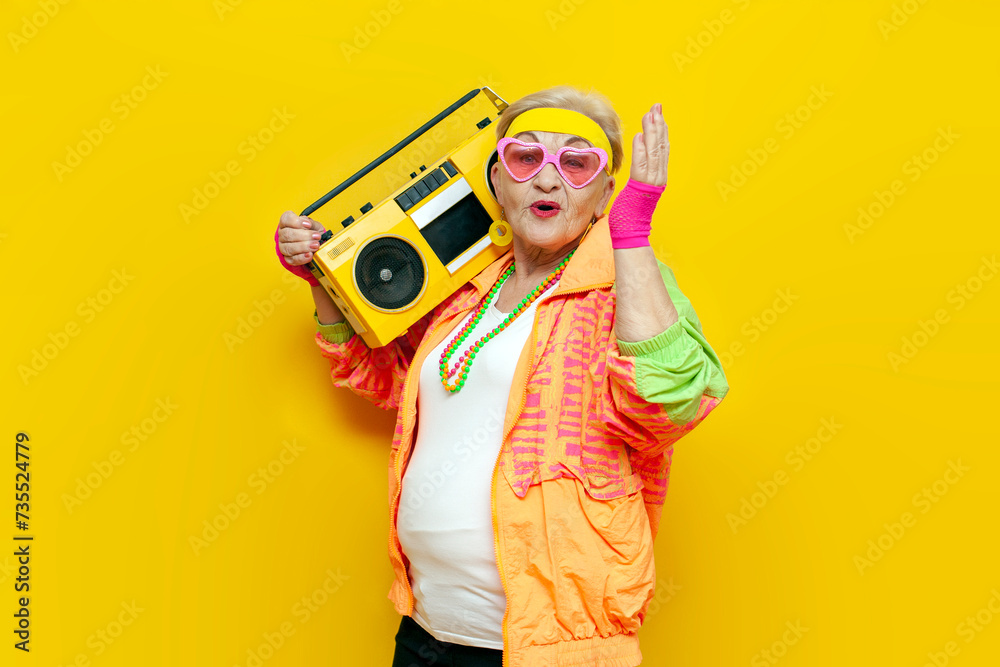 funny crazy granny in hipster clothes listening to music on tape ...