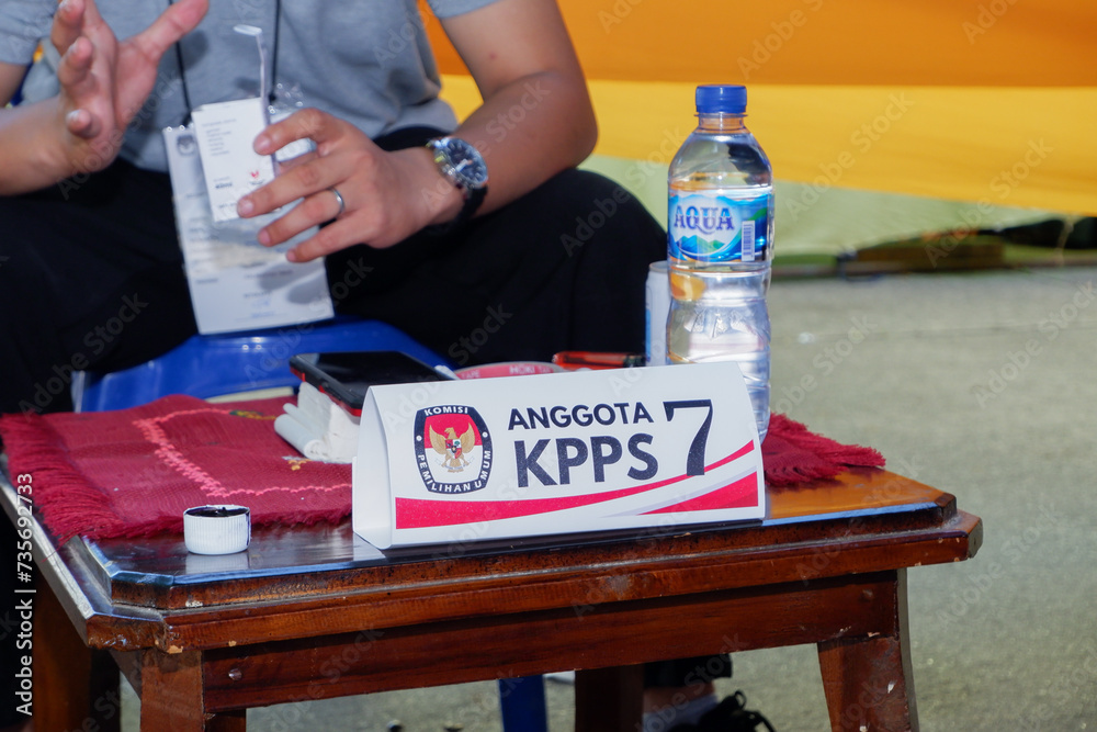 name plate for KPPS members at the polling station with a pile of ...