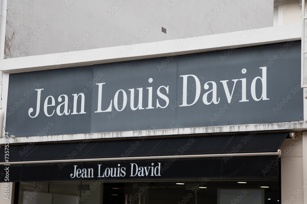 Jean Louis David sign text and brand logo france facade chain of ...