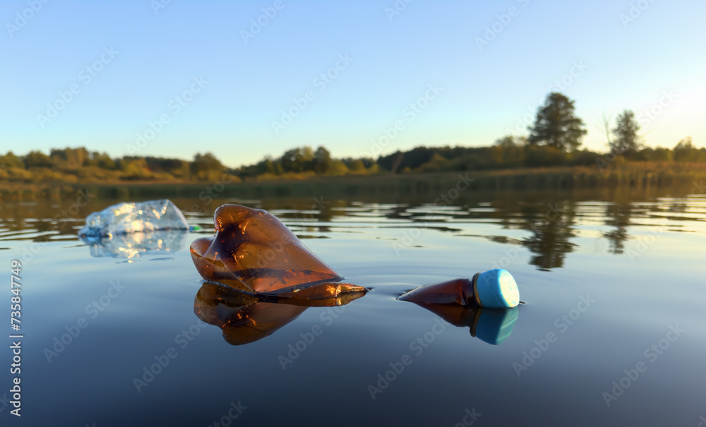 Marine plastic pollution. Plastic waste in lake. Microplastics ...