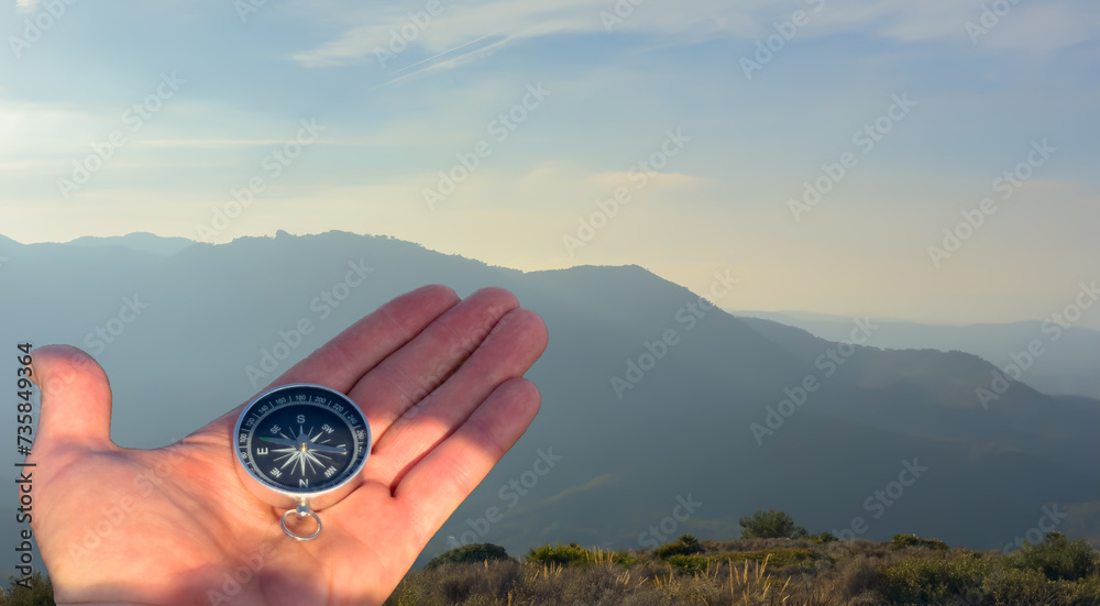 Compass in hand in mountains during Hiking. Tourist compass for ...