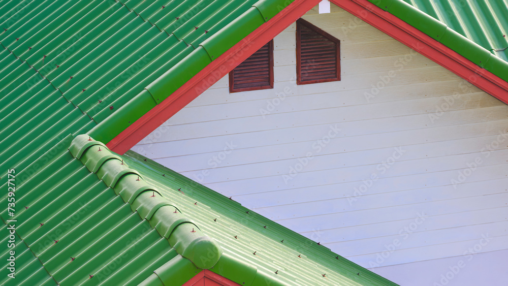 Green concrete tile polygonal roof and white wooden gable combination ...