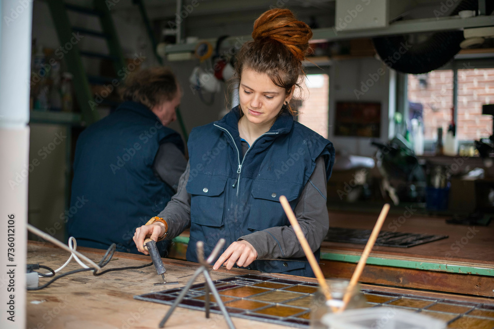 apprentice glass maker, stained glass craftman inspecting herwork Stock ...