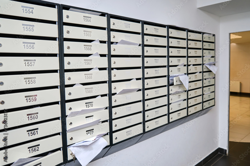 Mail boxes with overflowing documents and bills. Mailboxes with letters ...