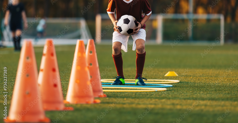 Soccer Boy Holding Ball in Hands and Jumping Over Hurdles Trail. Sports ...