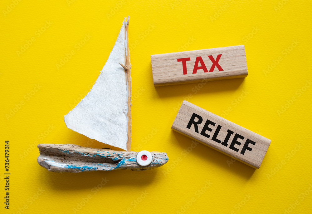 Tax Relief symbol. Concept word Tax Relief on wooden blocks. Beautiful ...