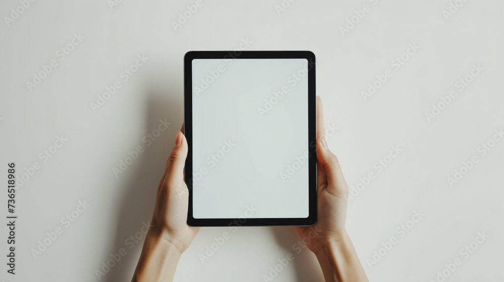 A sleek and modern tablet screen mockup, held effortlessly in hands ...
