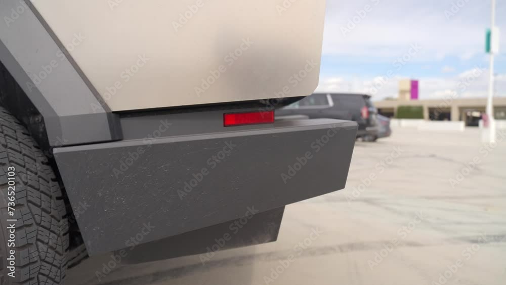 Front and side views of a futuristic electric car with an angular ...