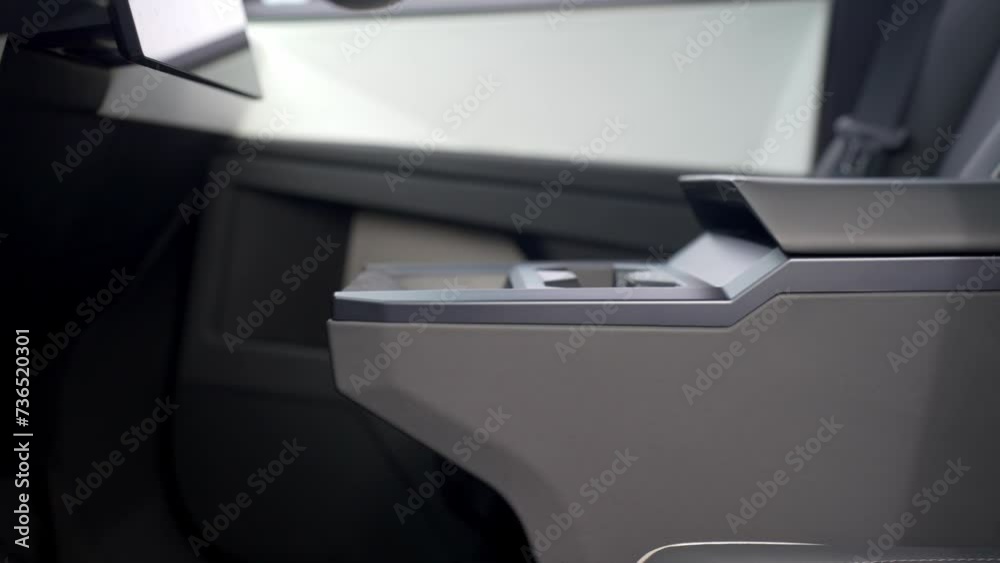 Front and side views of a futuristic electric car with an angular ...