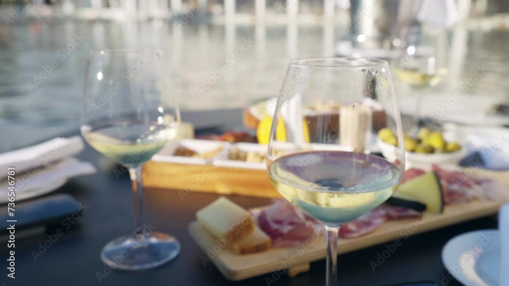 Vidéo Stock Amazing friends or couple aperitif time on the pool side of ...