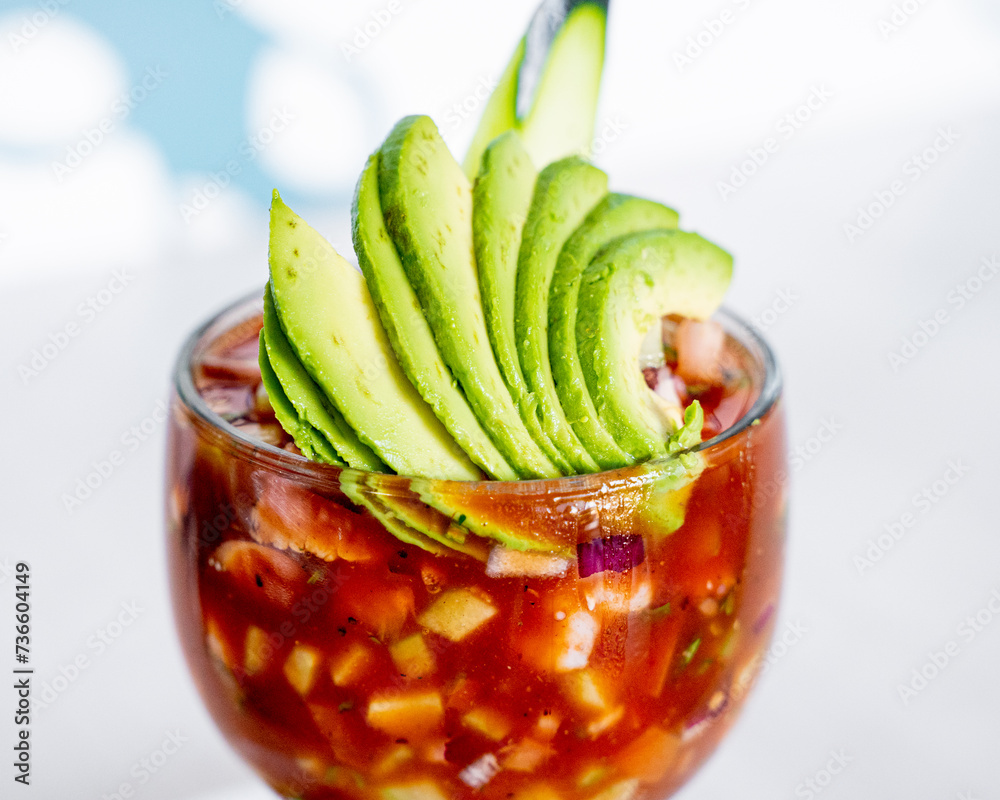Mexican style seafood cocktail with shrimp, octopus, squid, tomato ...