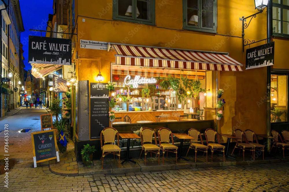 Evening view of an illuminated Cafe' Valvet Bistro and restaurant in ...