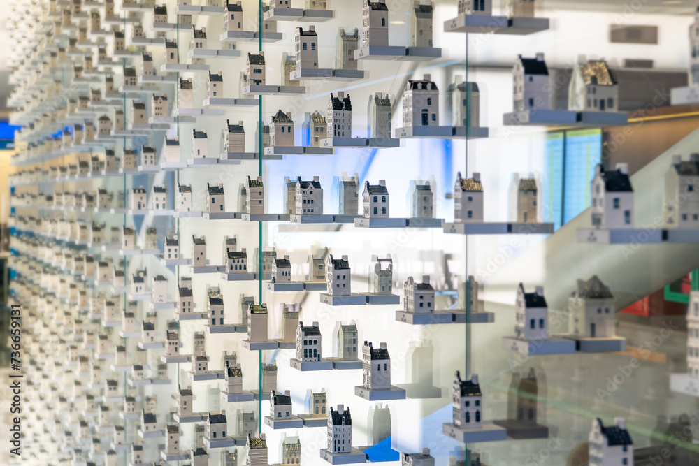 Rows of KLM Airline blue ceramic Dutch Delft houses lining the mirrored ...