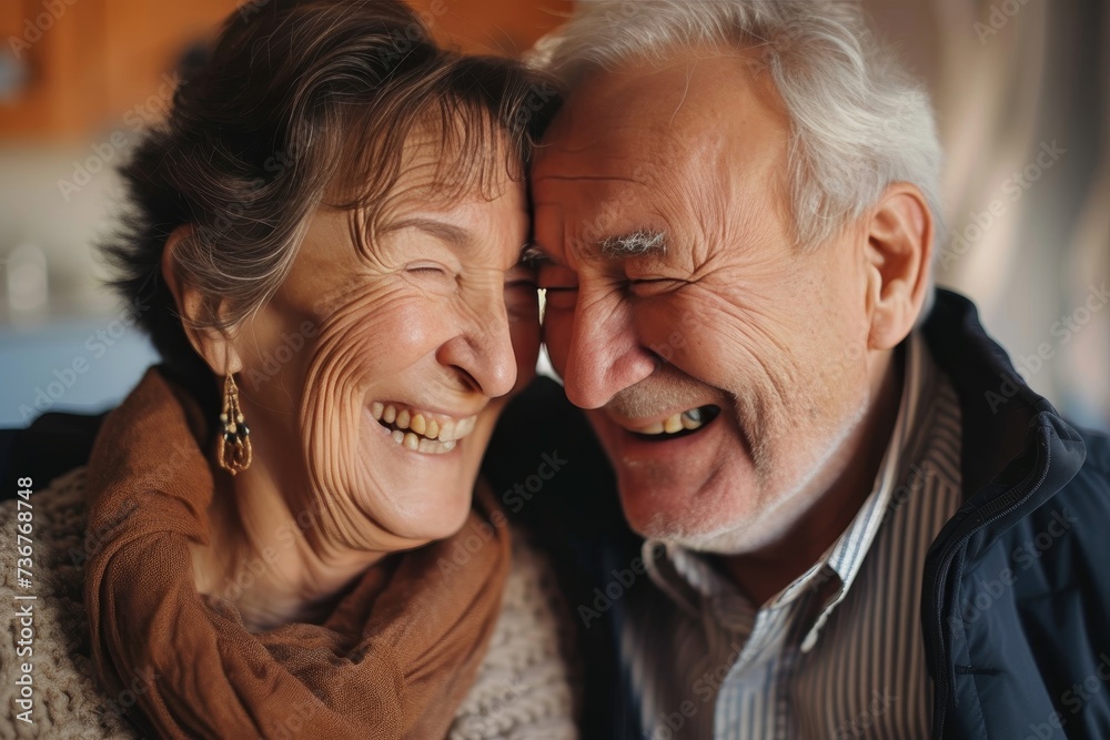 An intimate moment between an older couple shown in a warm and cozy ...