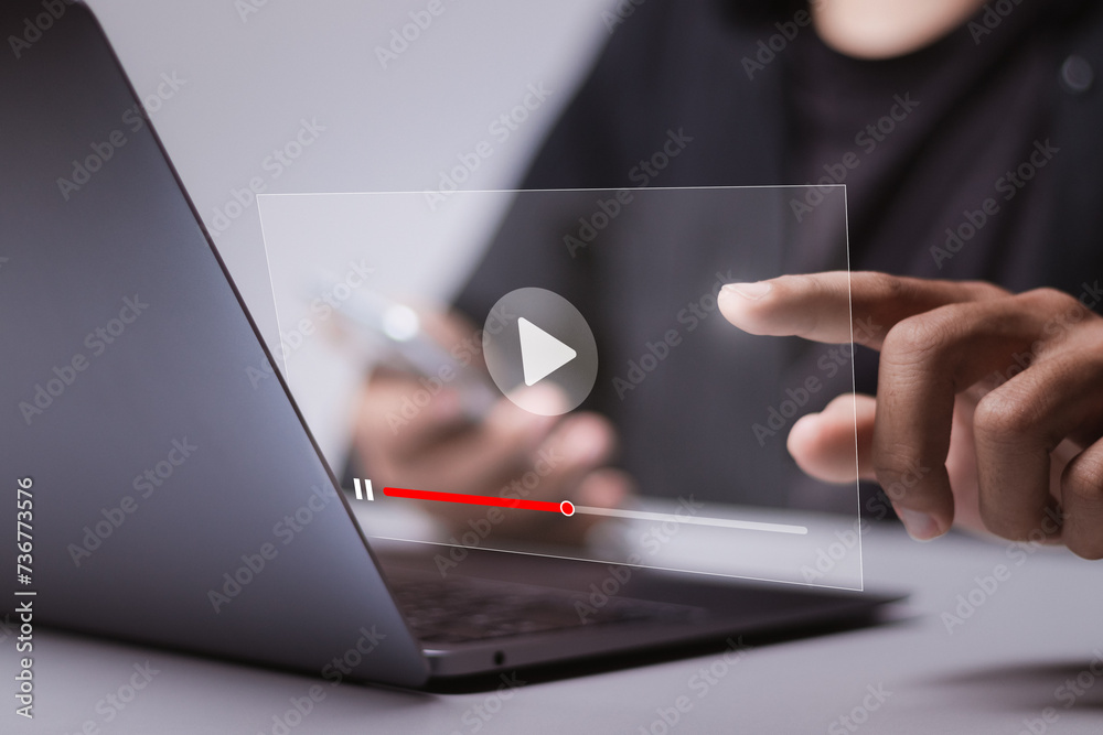 Online streaming concept. Person using laptop watching video on ...