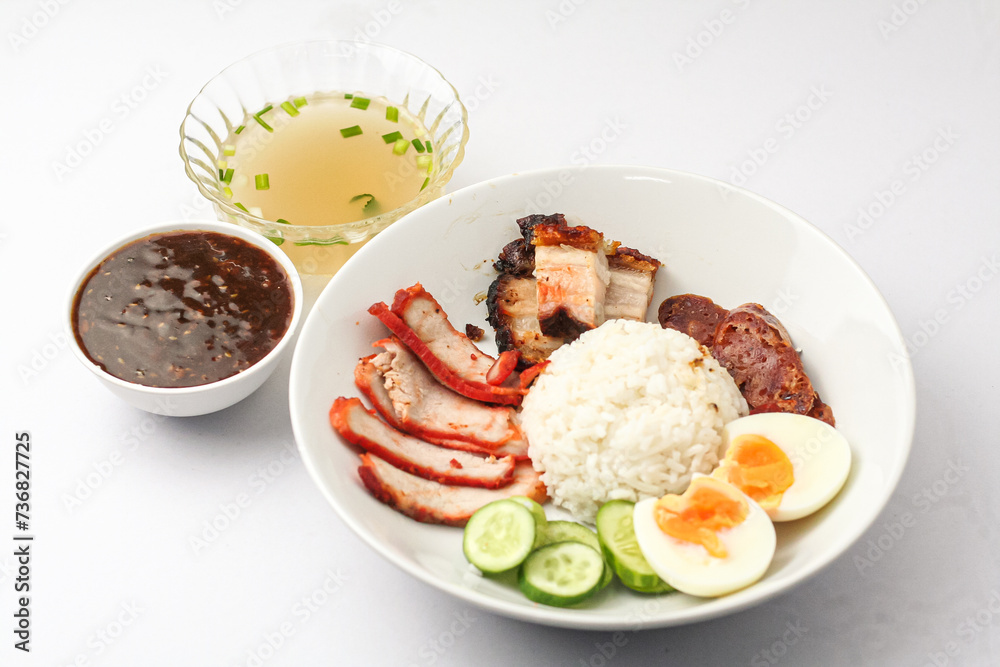 Red Pork and Crispy Pork on Rice Served with Chinese sausage, cucumber ...