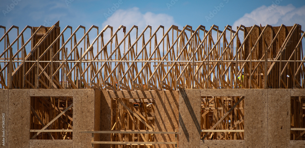 Wooden roof building. Standard timber framed building with roof trusses ...