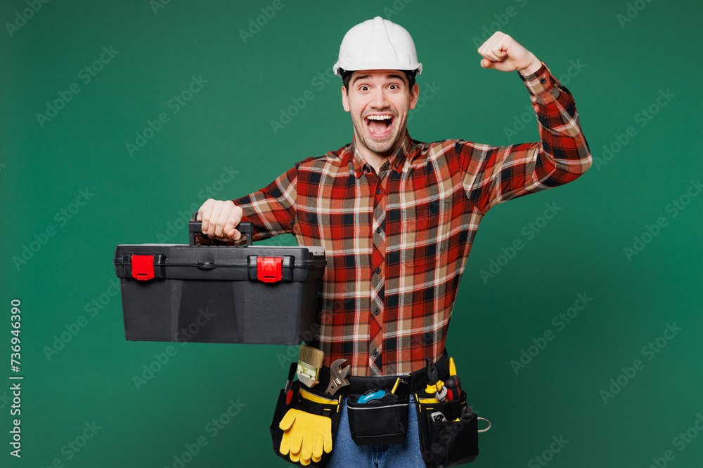 Young employee handyman man wears red shirt hardhat hat work hold ...