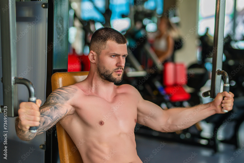 Muscular men lifting weights. Powerful male fit model doing workout in ...