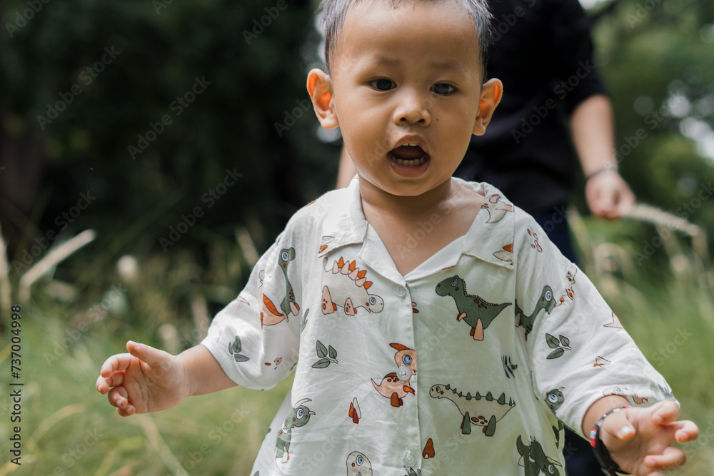 Cheerful Boy Running around and Playing Happily at the Park. Kid ...