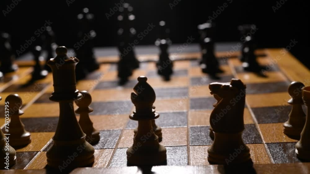 Cinematic shot of a chessboard with pieces on it, the camera moves from ...