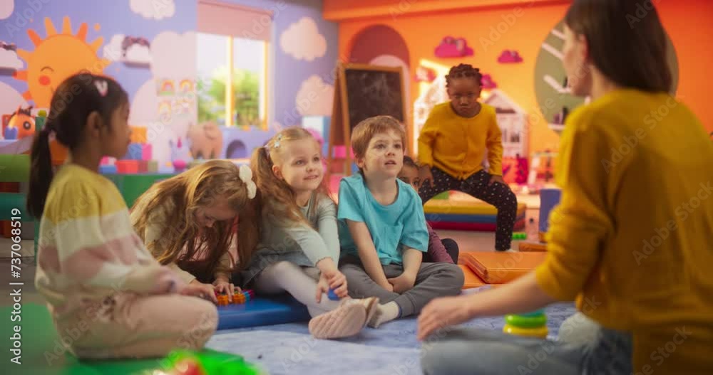 Cheerful Daycare Teacher Telling Educational Fairytales to Multiethnic ...