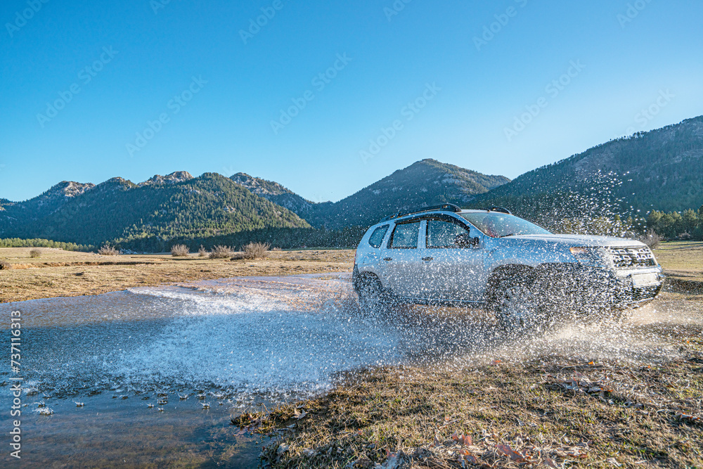 Eynif, Antalya, Turkey-February 2, 2024:The suv car is splashing the ...