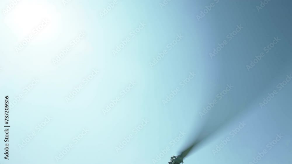 Vidéo Stock Main rotor blades of helicopter rotating against blue sky ...