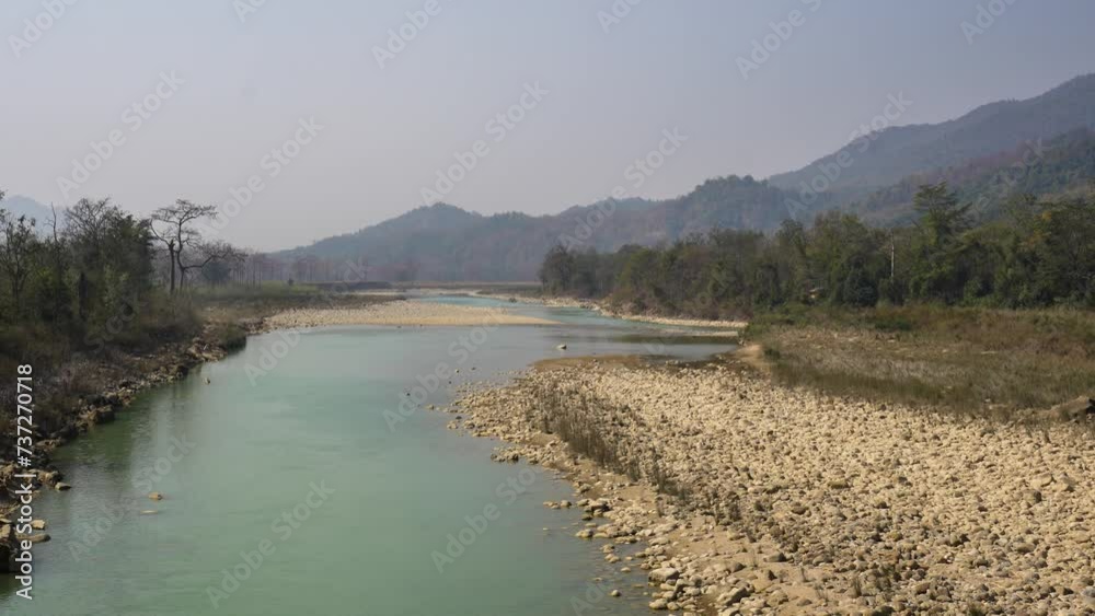 Mesmerizing beauty of Nepal as a river gracefully flows through ...