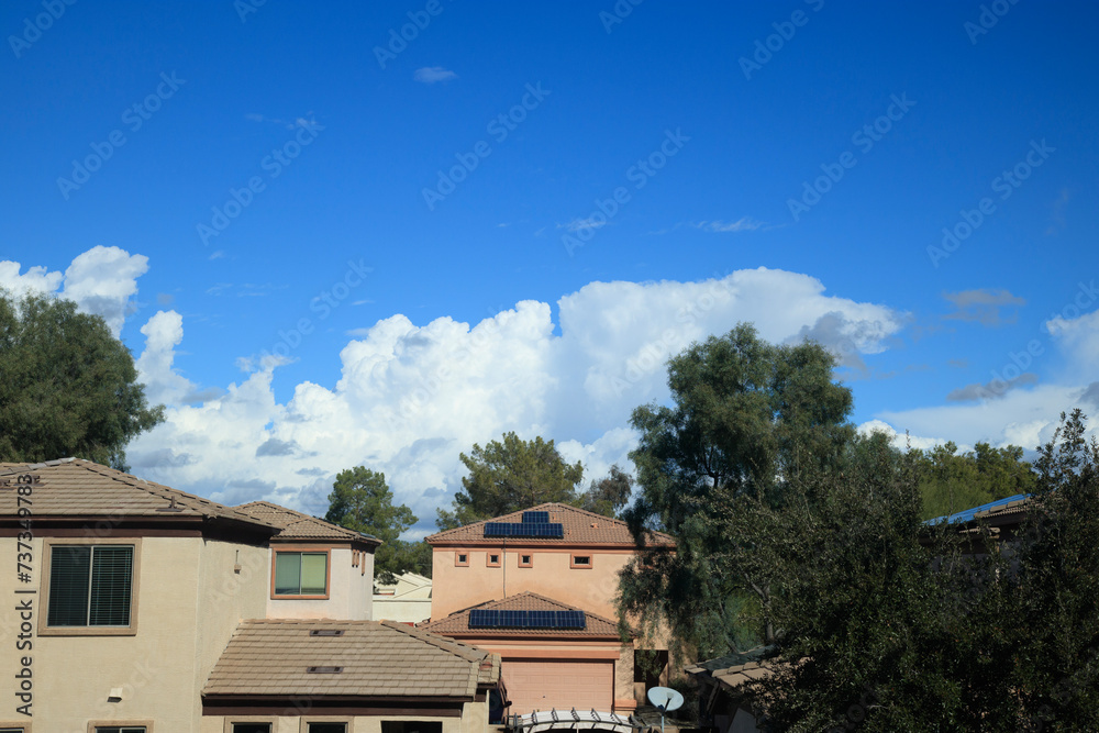 Arizona typical residential house tile roofs under slowly rising dense ...