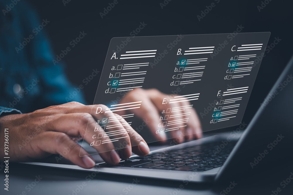 man's hand is selecting the correct answer to make an evaluation or ...