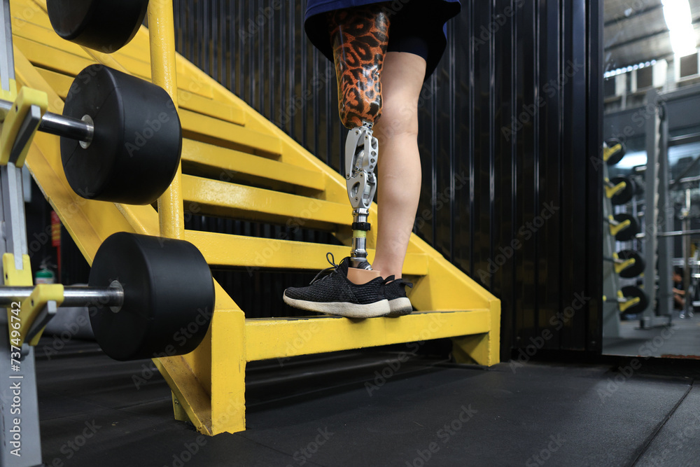 Disabled athletes practice exercise in the gym. Practice going up and ...