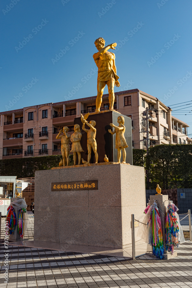 Gold statue in memory of schoolchildren and teachers at the Atomic Bomb ...