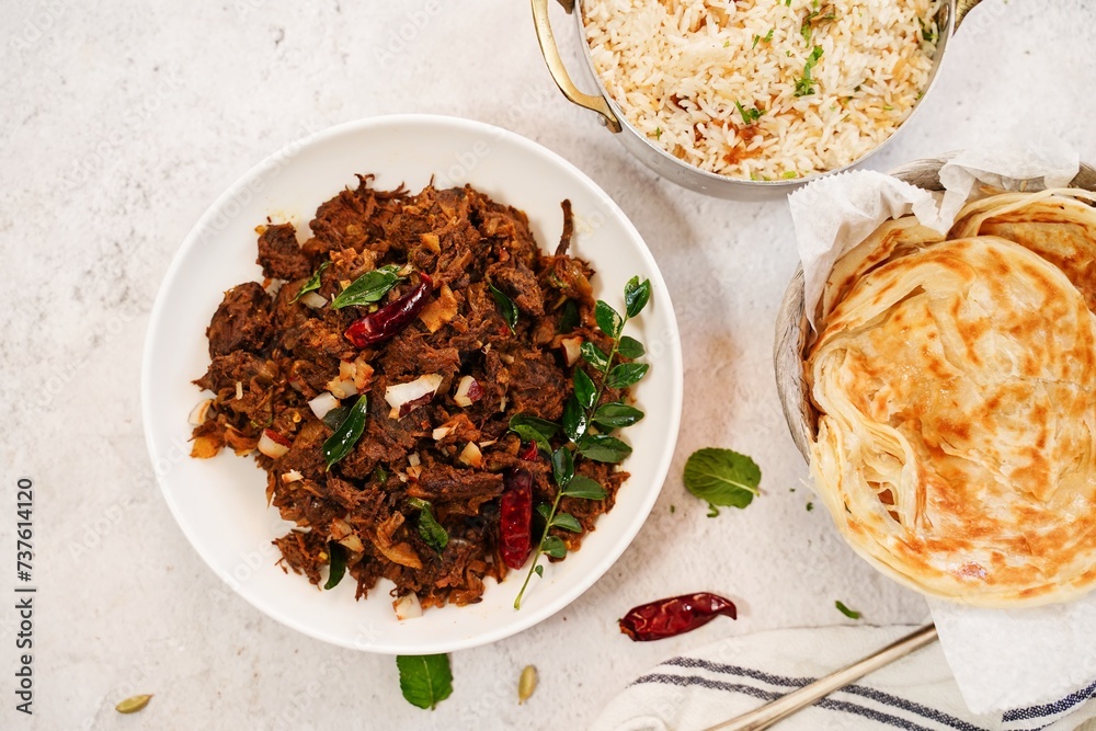 Plakat Kerala beef fry roast served with parotta and ghee rice ...