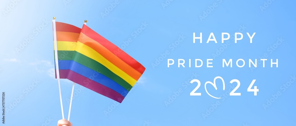 Happy Pride Month 2024 on rainbow flags raising background, concept for ...