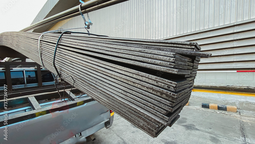 Flat steel bars stacked in abstract form. Stack of steel flat bar of ...