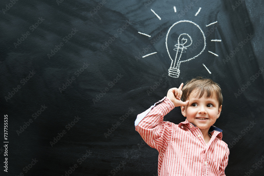 Child, thinking and lightbulb on chalkboard for solution, learning and ...