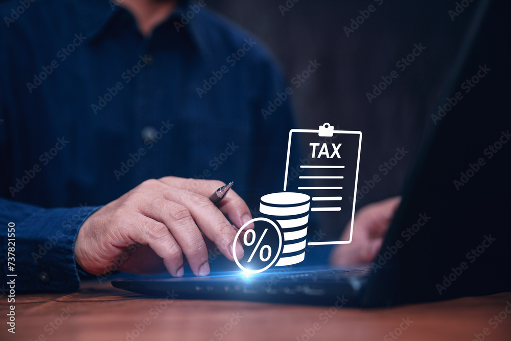 Calculating tax refunds and VAT Businessman uses laptop with virtual ...